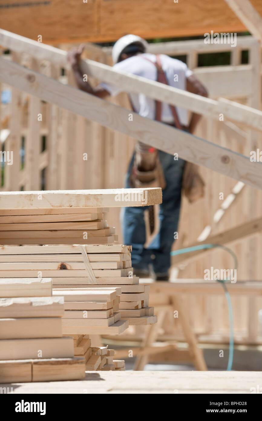 Carpenter working at a construction site Stock Photo - Alamy