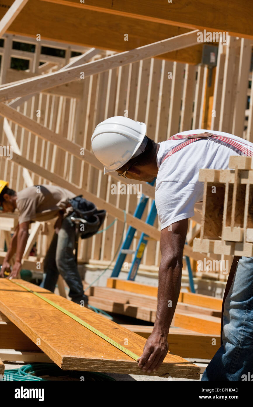 Carpenters measuring beams Stock Photo - Alamy