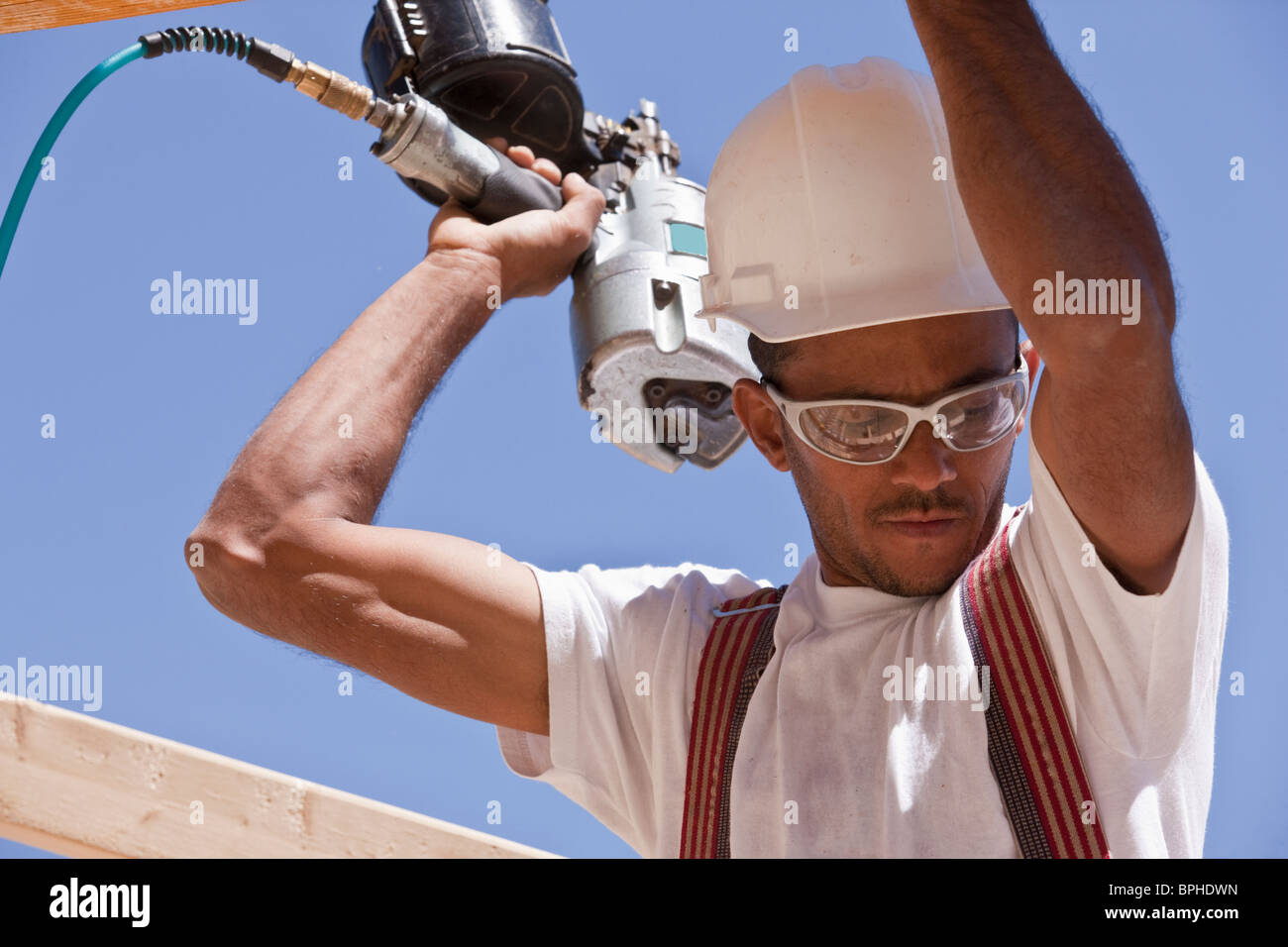 Carpenter using a nail gun Stock Photo - Alamy