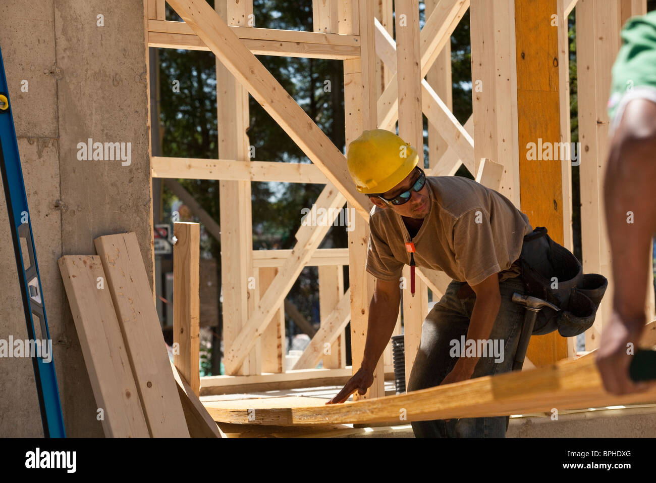 Carpenters lifting beam Stock Photo - Alamy