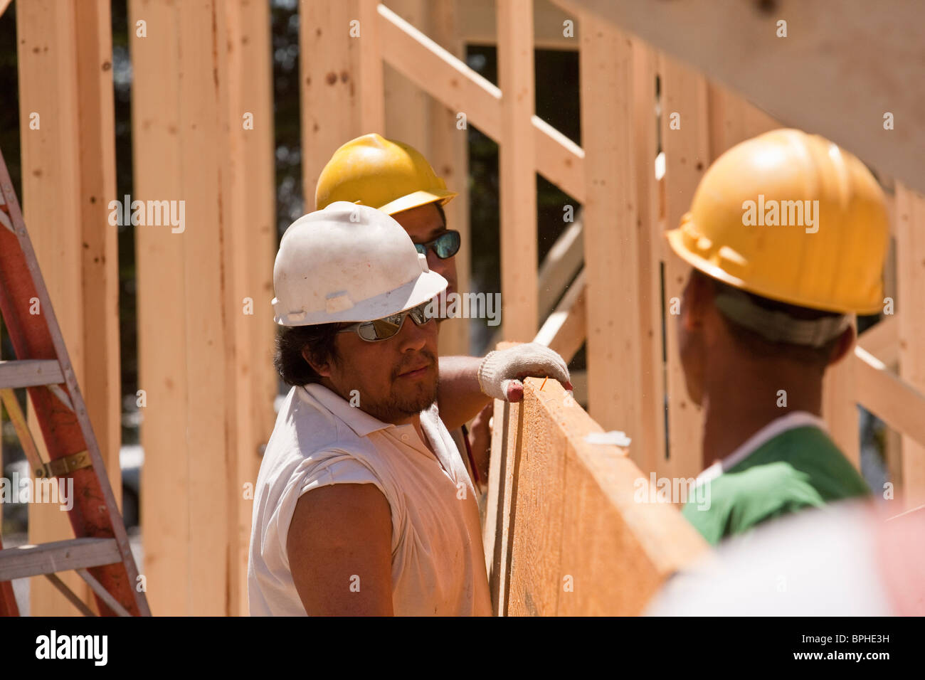 Carpenters lifting beam Stock Photo - Alamy