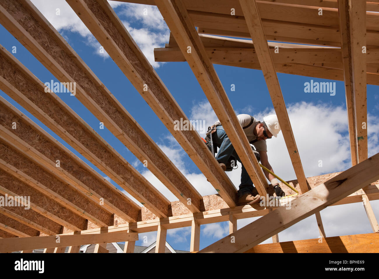 Carpenter working on second floor of a house Stock Photo - Alamy
