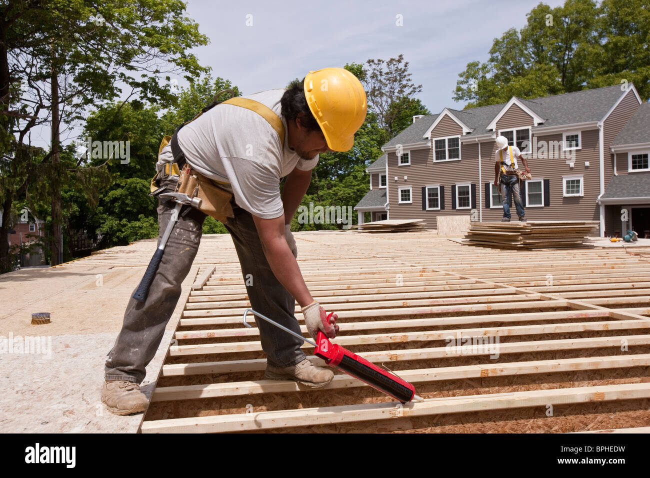Carpenter using a caulk gun Stock Photo - Alamy
