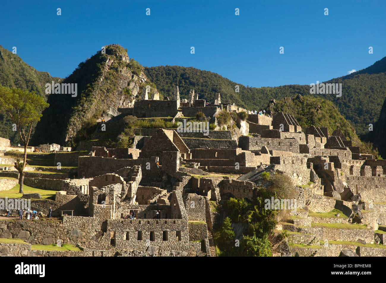 Intricate stonework of ruined buildings at the ancient Incan city of ...