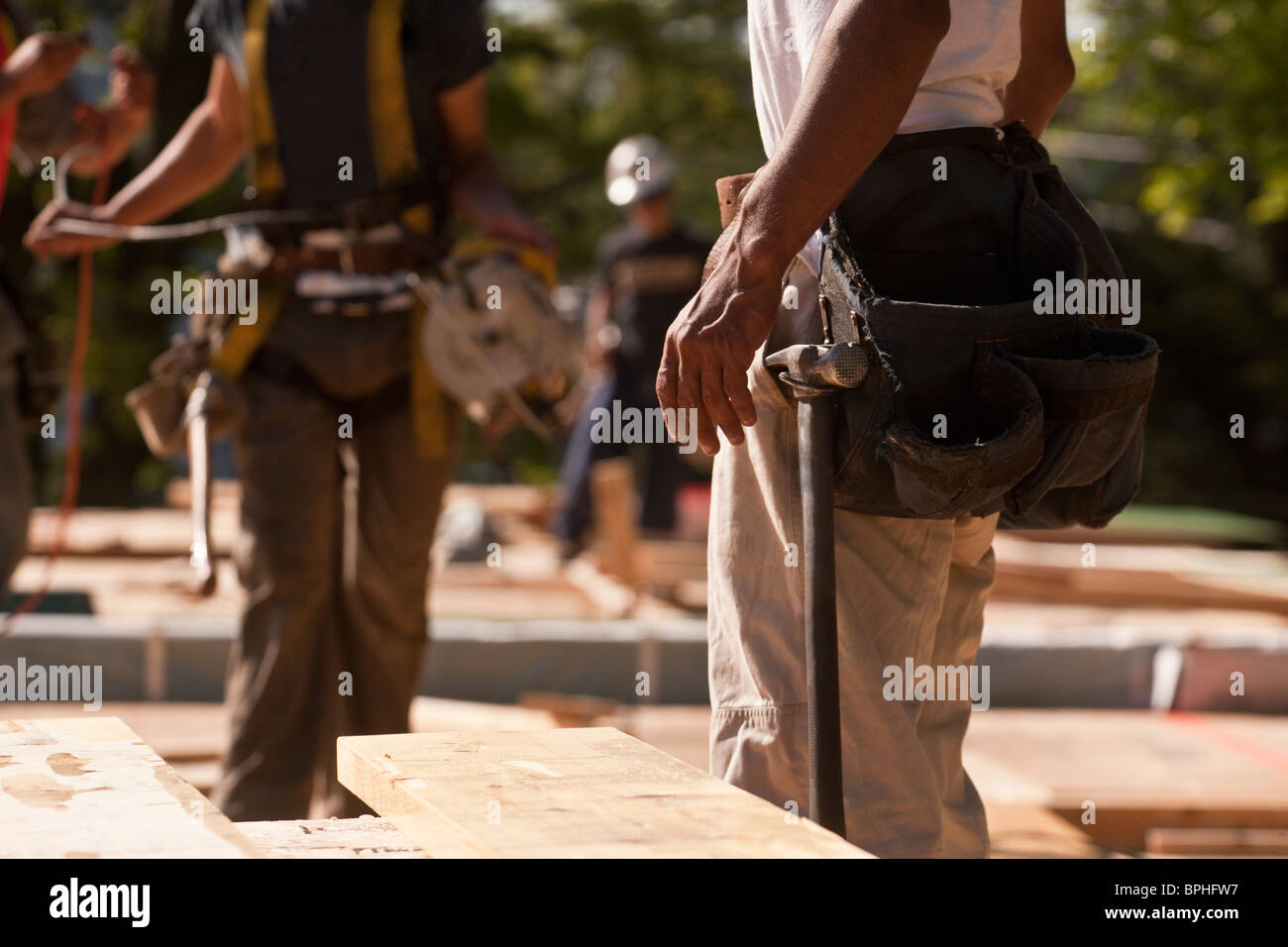 Carpenters working at a construction site Stock Photo - Alamy