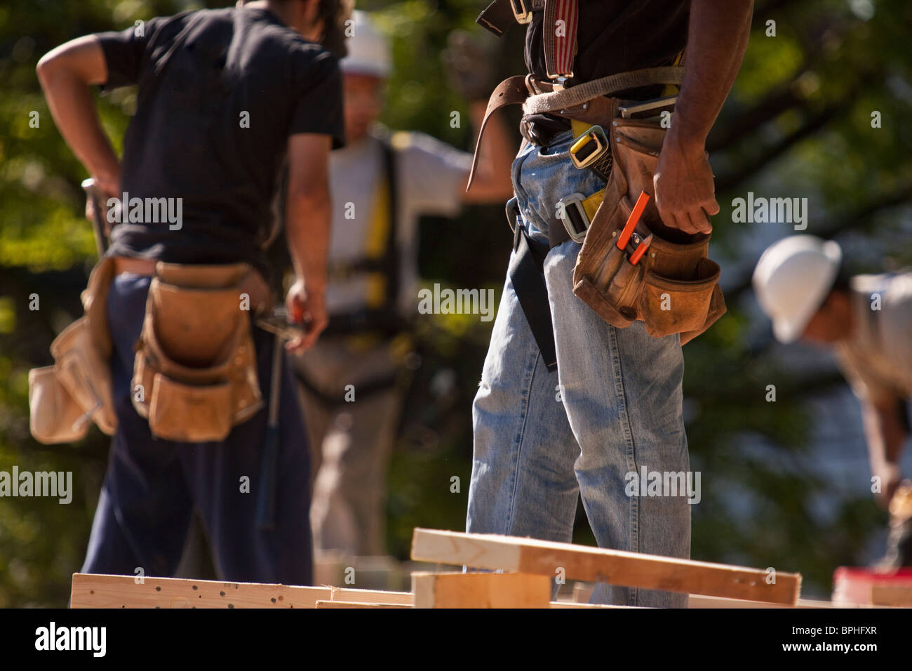 Carpenters working at a construction site Stock Photo - Alamy