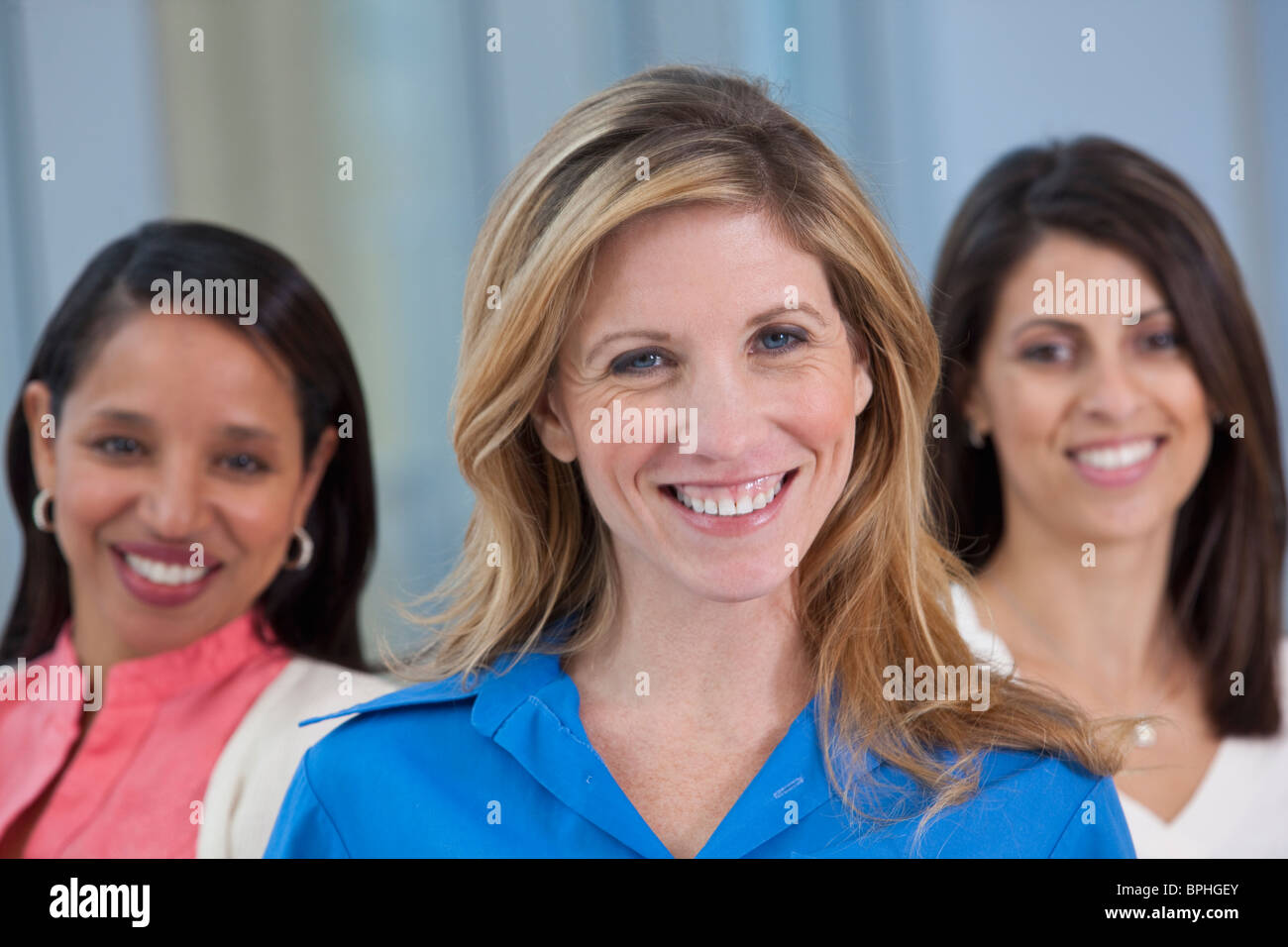 Portrait of a woman smiling with her friends in the background Stock ...