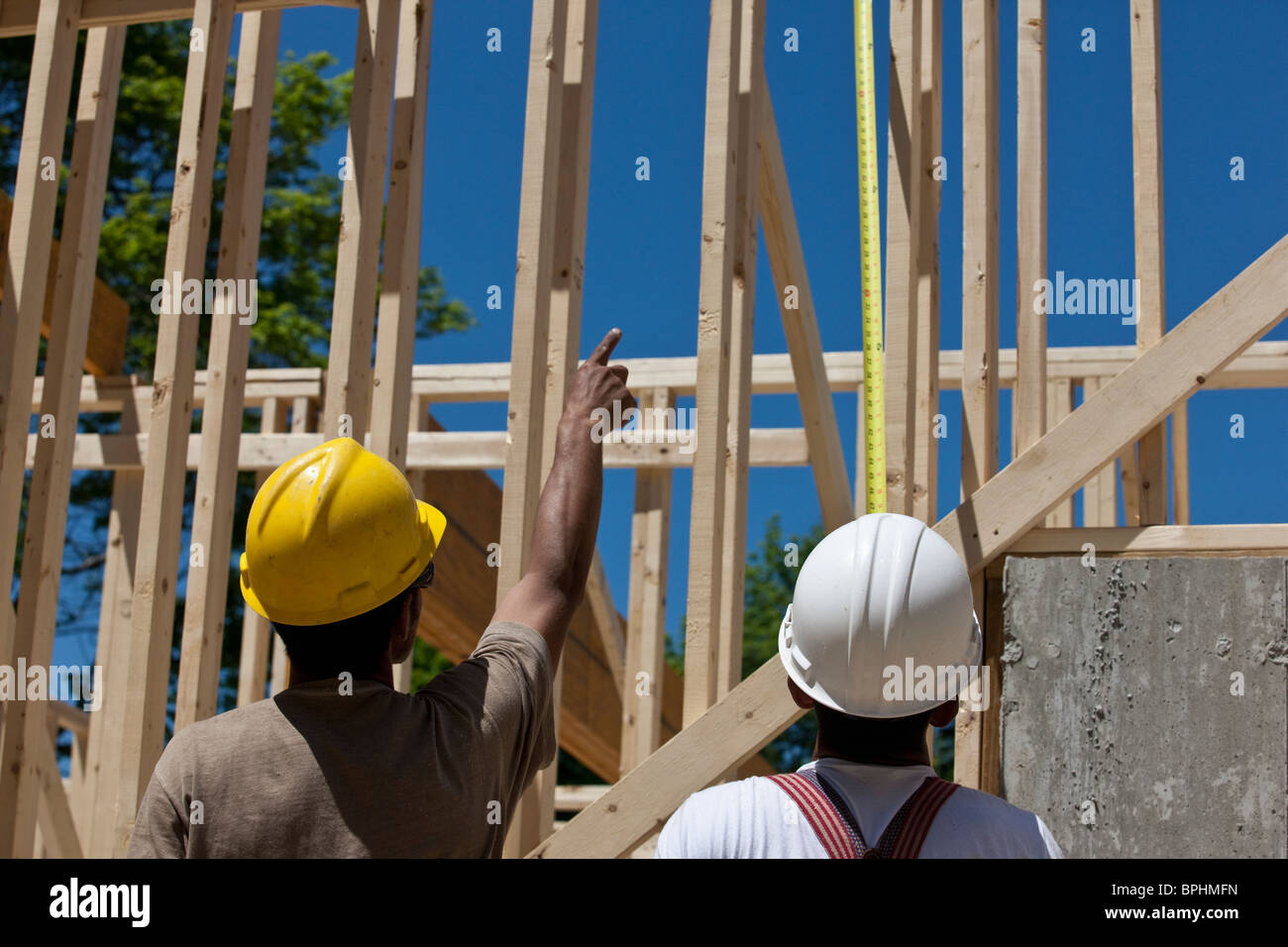 Carpenters planning at a construction site Stock Photo - Alamy