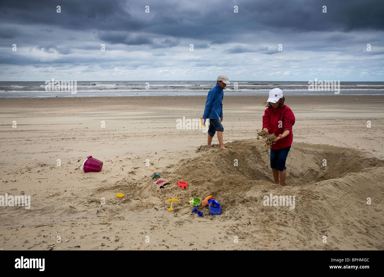 kids playing on the beach on a cold summer day in holland Stock Photo ...