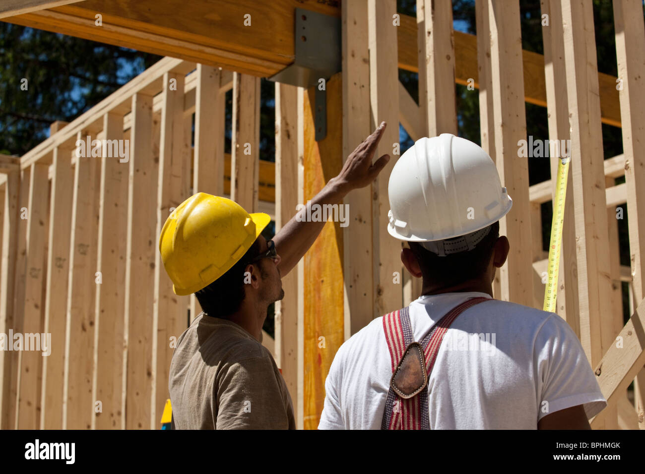 Carpenters planning at a construction site Stock Photo - Alamy