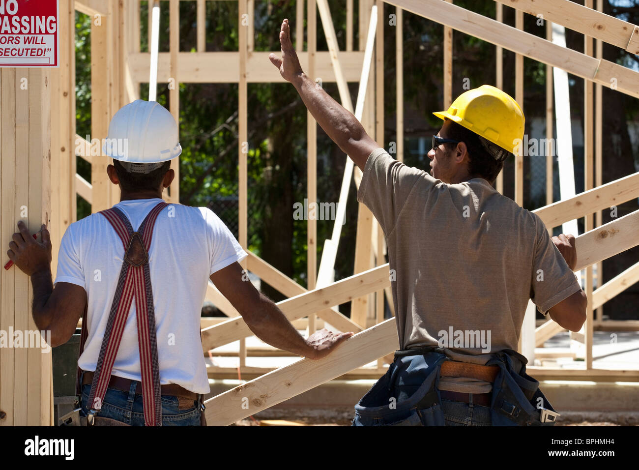Carpenters working at a construction site Stock Photo - Alamy