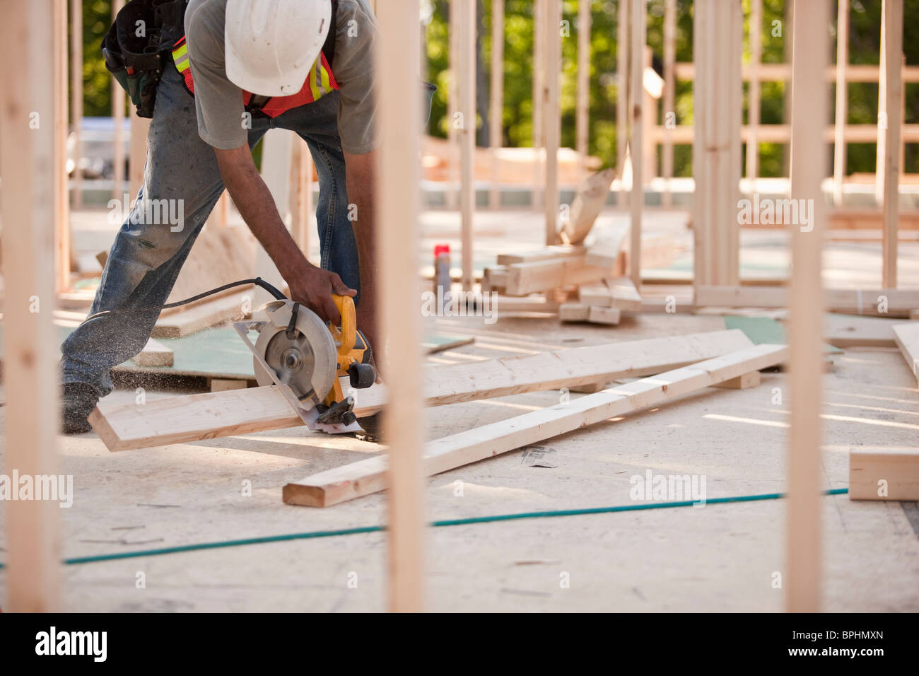 Carpenter cutting frame with a circular saw Stock Photo - Alamy