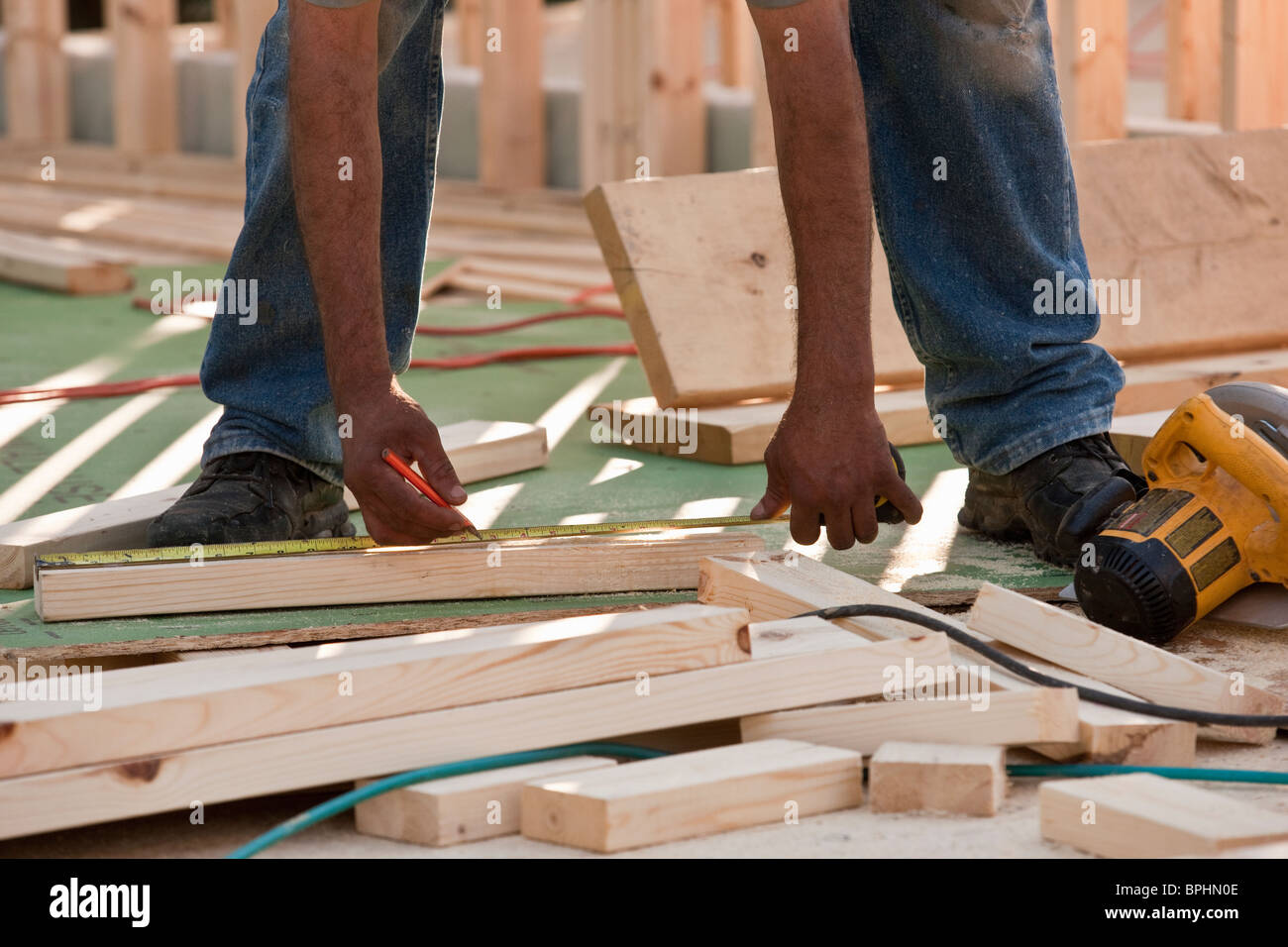 Carpenter measuring wood Stock Photo - Alamy