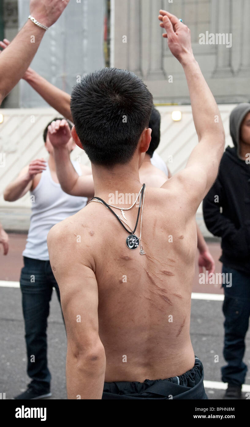 Shia muslim men beat their chest during Arbaeen procession in central ...
