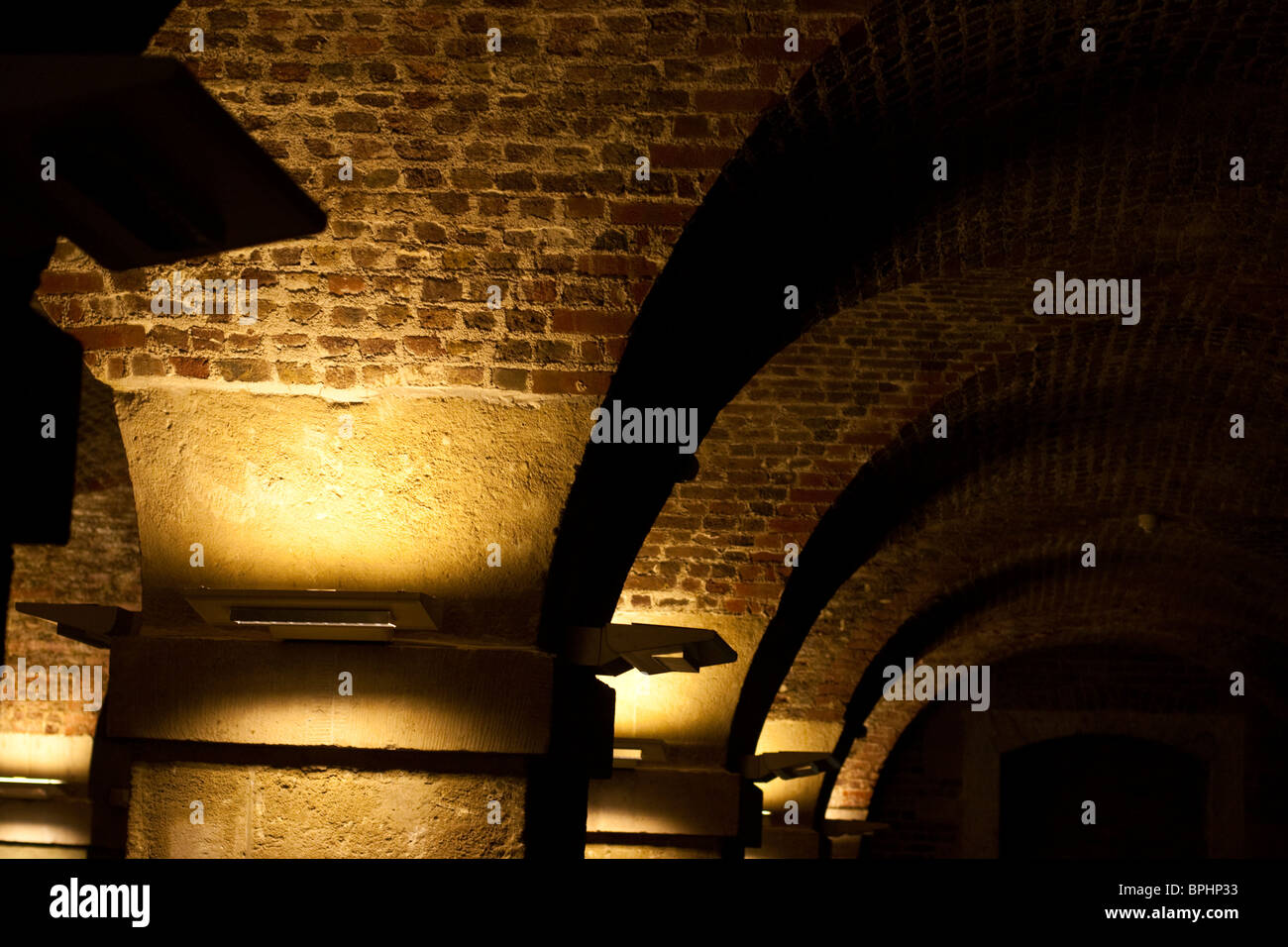 Lit brick pillar tops and arched ceiling Stock Photo - Alamy