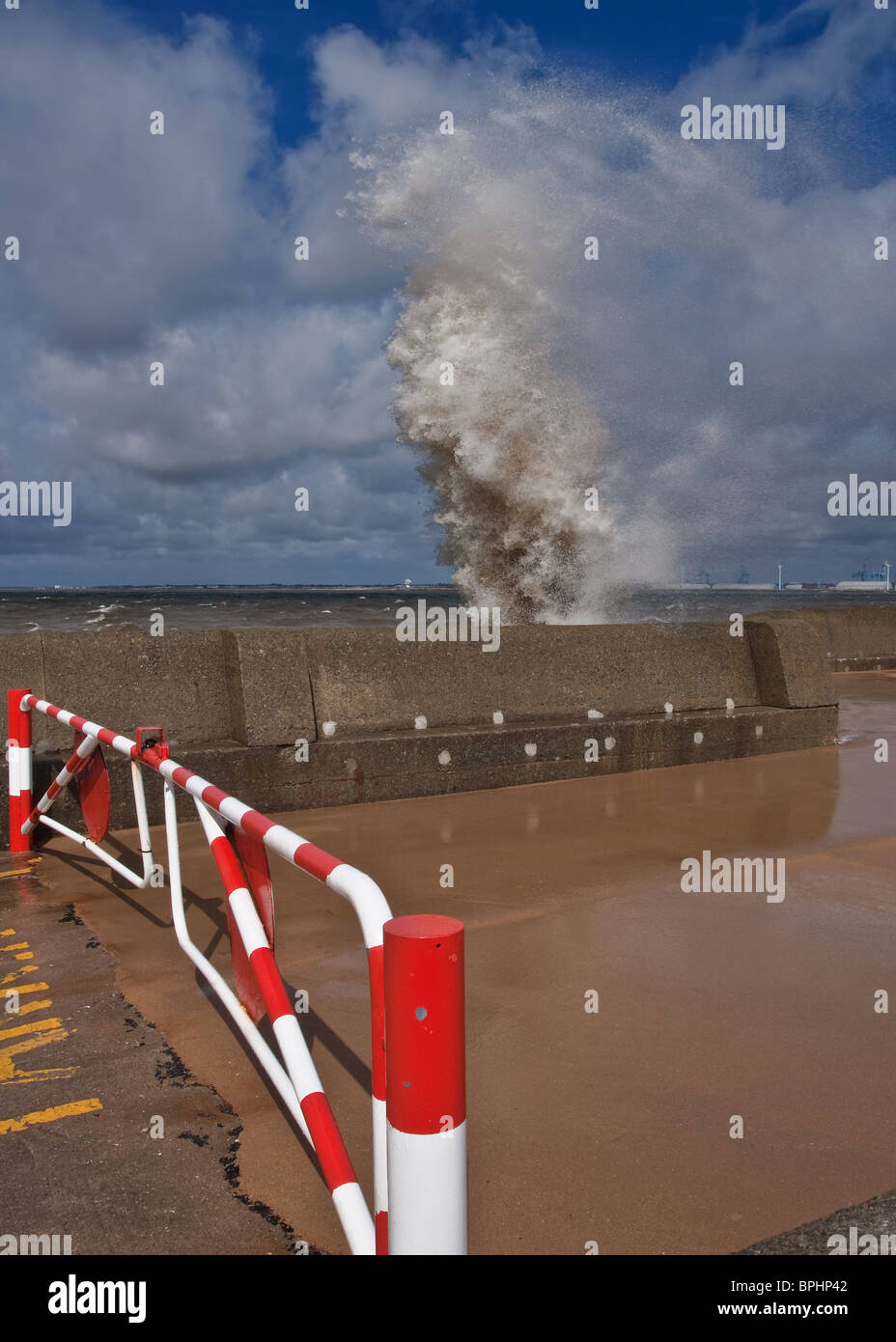 Wave hits sea wall Stock Photo - Alamy