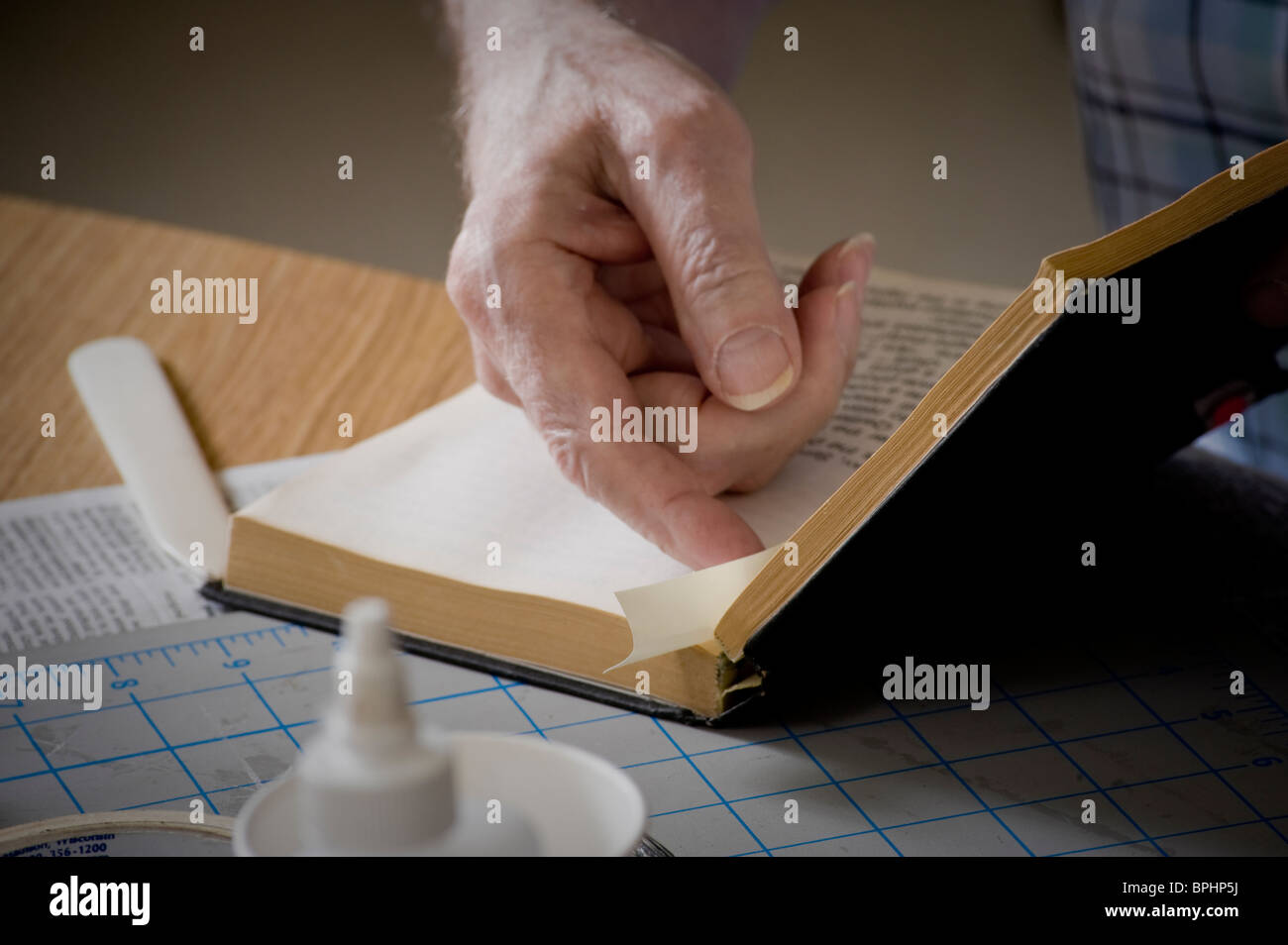 Old Man Hands Bookbinder Repairing An Old Book, Pennsylvania, USA Stock ...