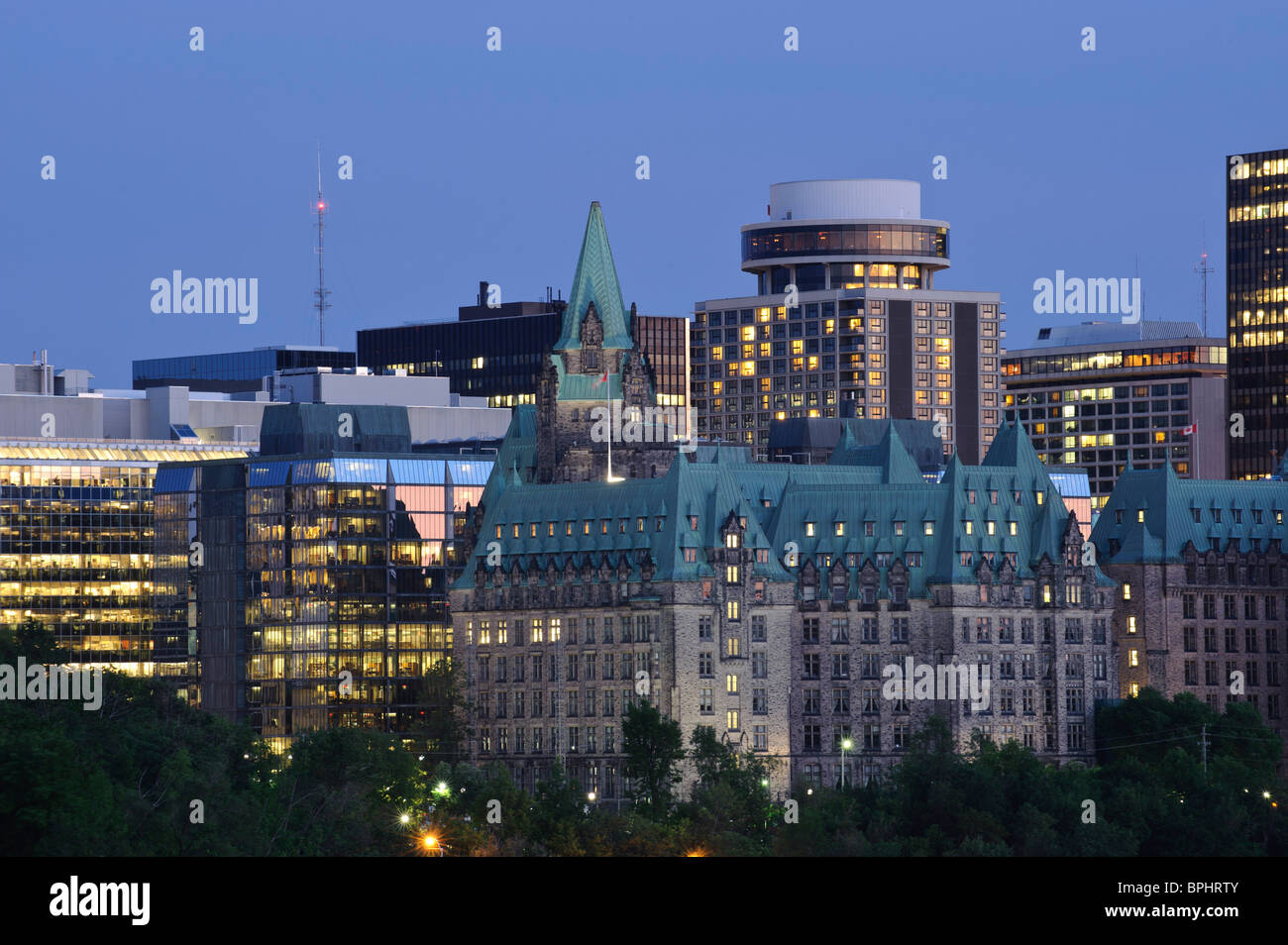Illuminated Ottawa skyline with office and Parliament Hill buildings ...