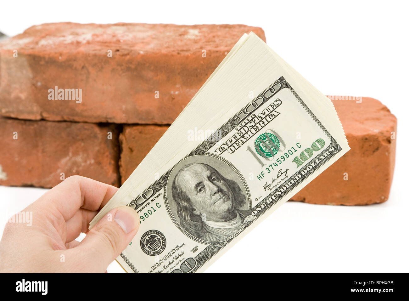 Red Brick and Dollar with white background Stock Photo - Alamy