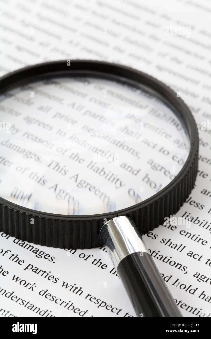 Magnifying Glass and document close up Stock Photo - Alamy