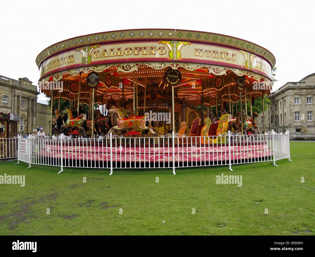 Old fashioned carousel outside York castle museum Stock Photo - Alamy