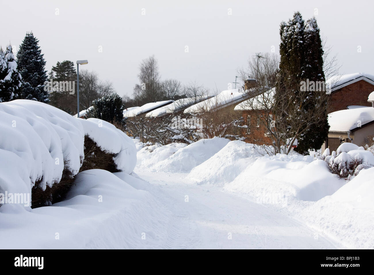 Winter street with lots of snow Stock Photo - Alamy