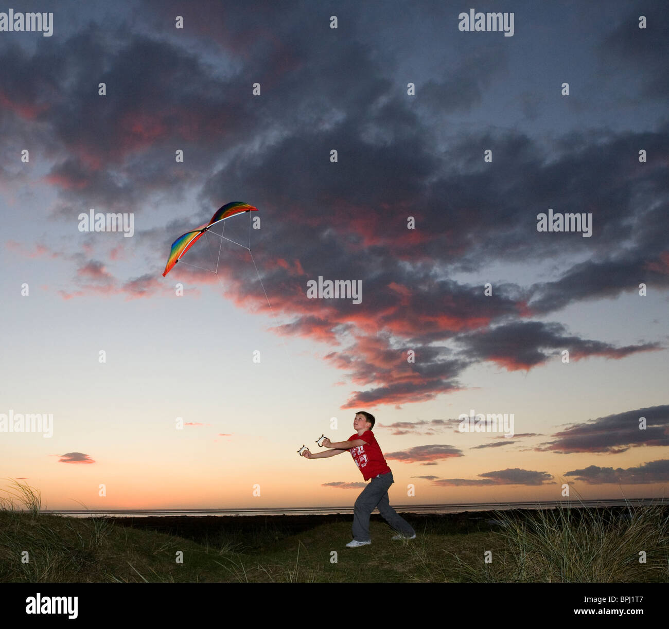 Flying kite sunset hi-res stock photography and images - Alamy
