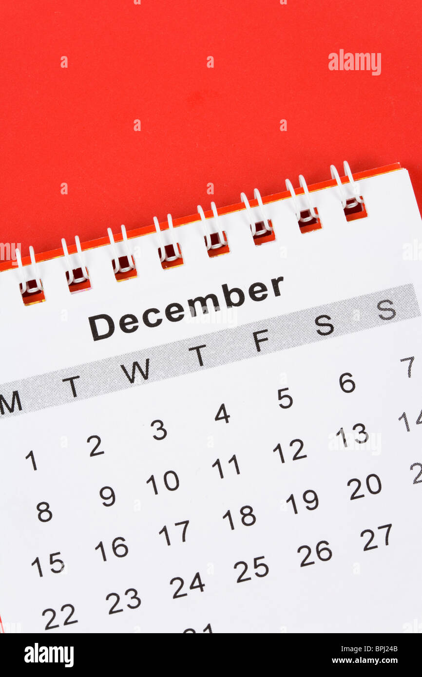 Calendar December close up with red background Stock Photo - Alamy