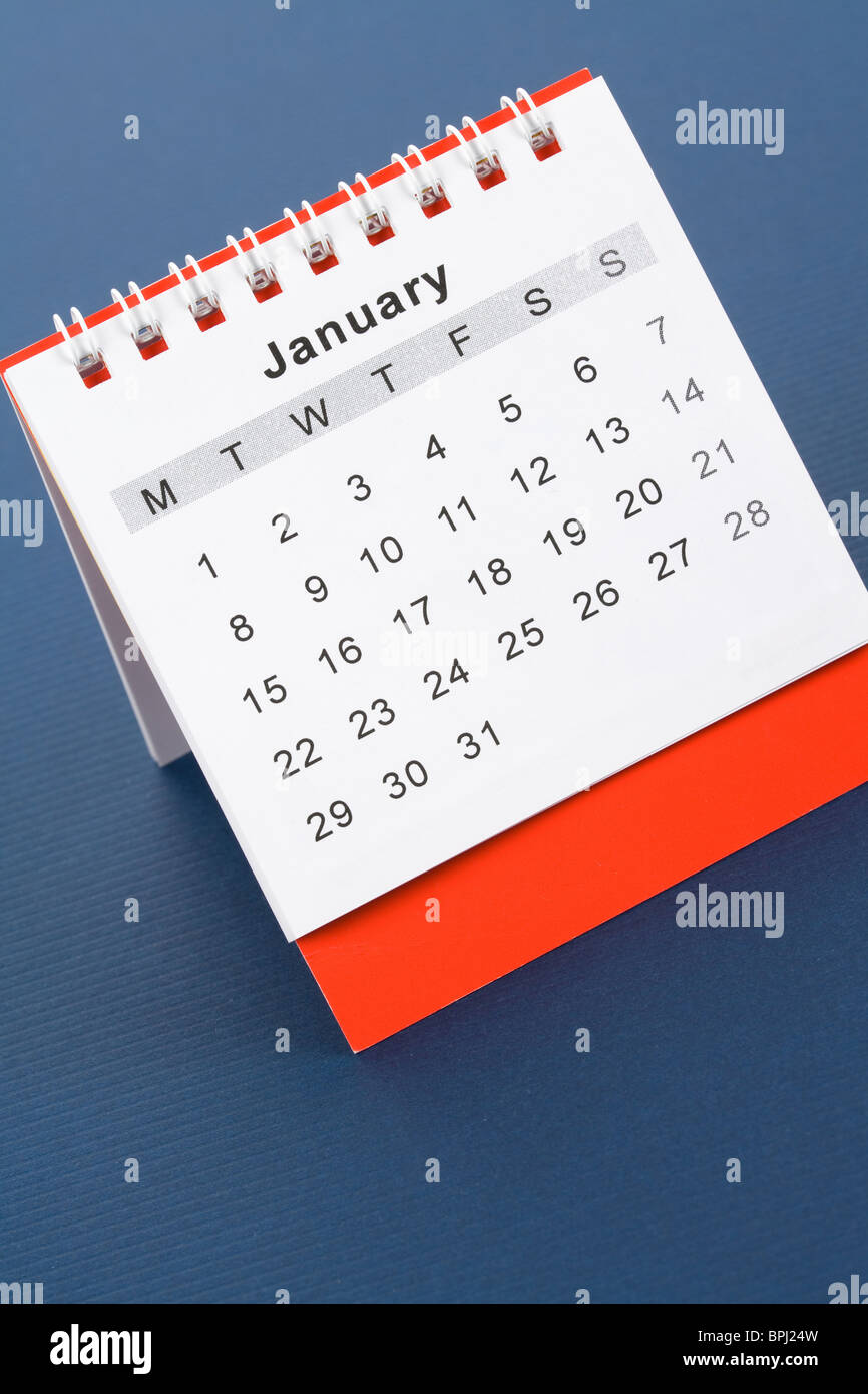 Calendar January close up with blue background Stock Photo - Alamy