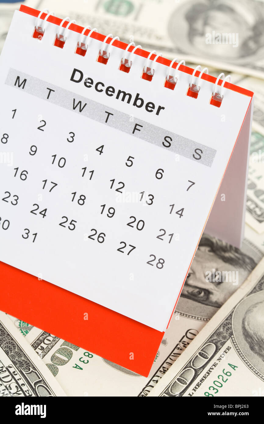 Calendar and dollar, December Stock Photo - Alamy