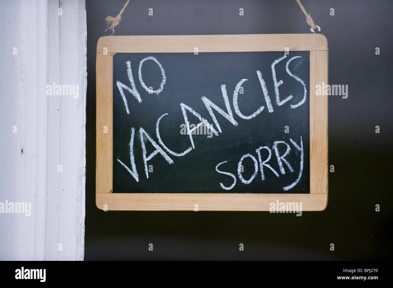 SORRY NO VACANCIES sign in window of guest house in the holiday seaside ...