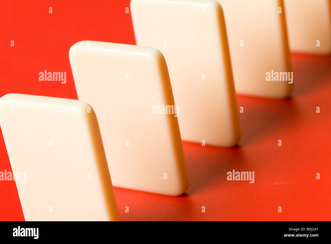 Domino with red background, Concept of Cause or Teamwork Stock Photo ...