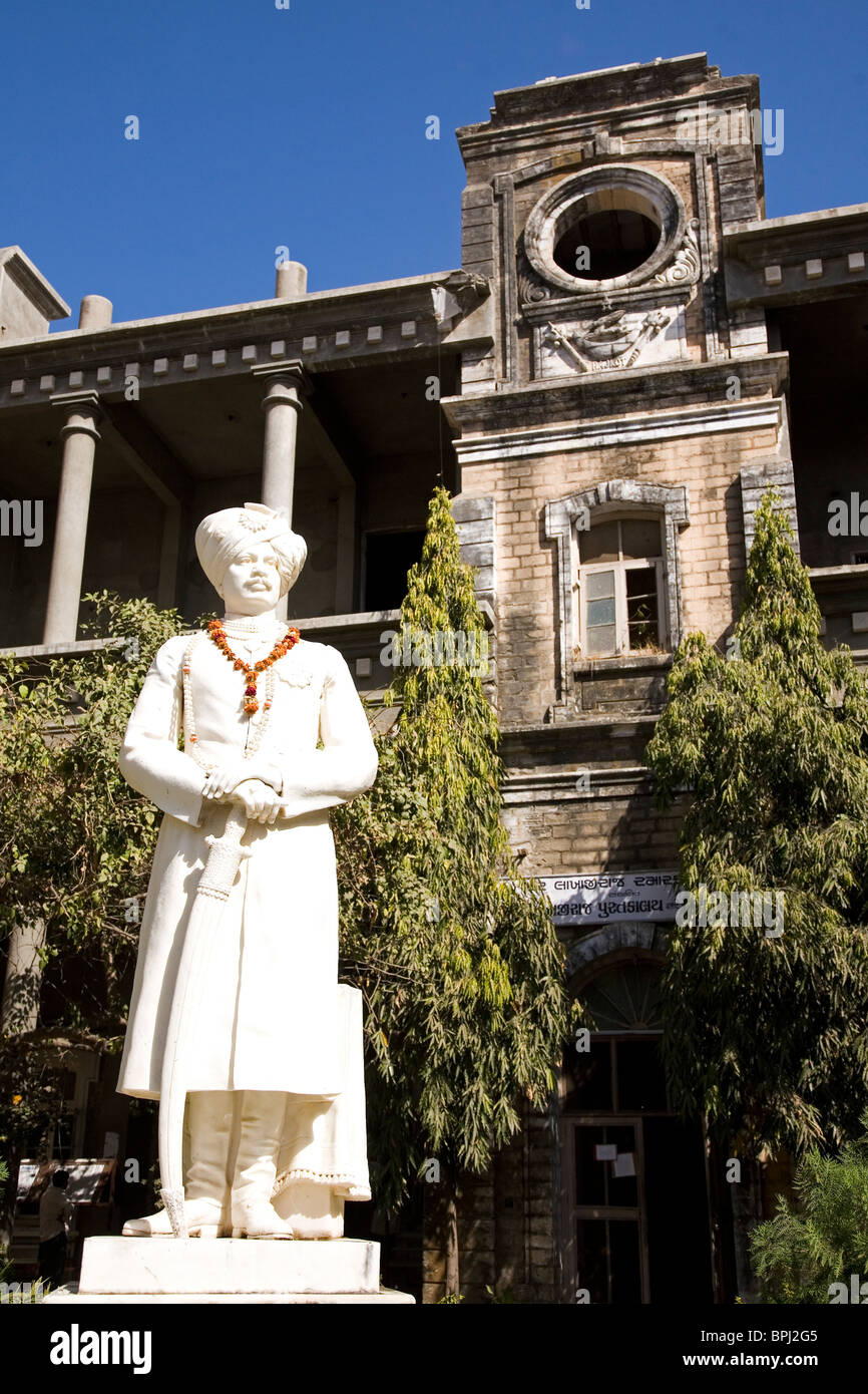 Statue of Raja stands in front of the college building in Rajkot ...
