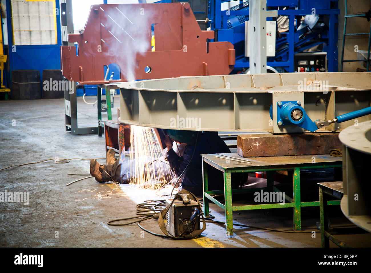 Man working at an industrial factory in Romania Stock Photo - Alamy