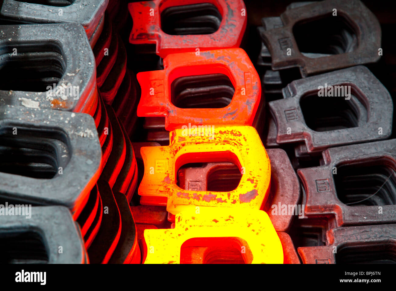 Background of burning stack of auto parts Stock Photo - Alamy