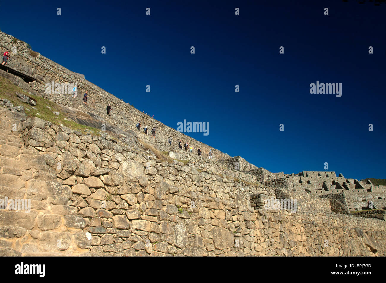 Intricate stonework of ruined buildings and garden terraces at the ...