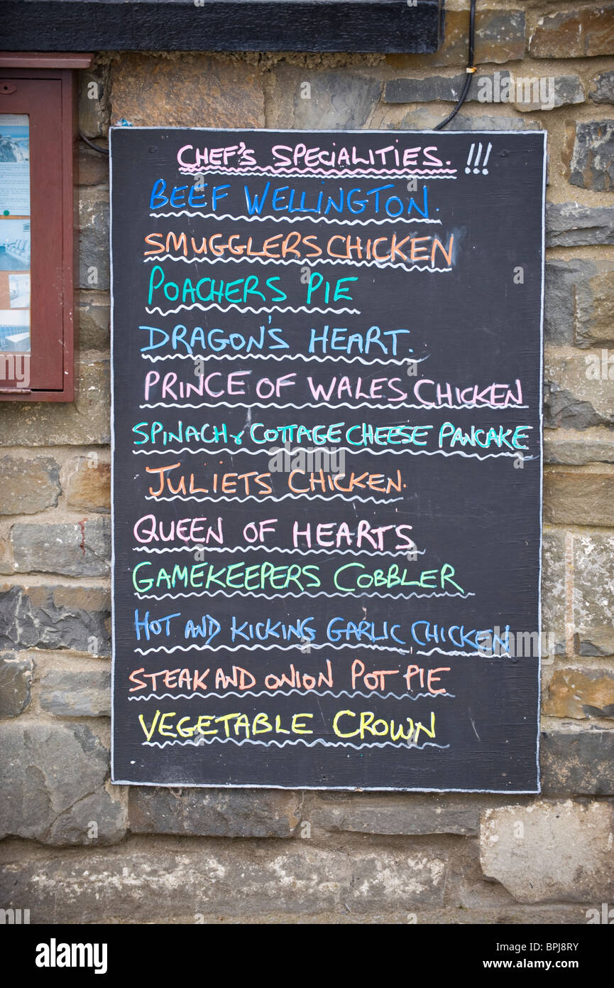 Chalkboard menu outside pub in the seaside holiday resort of New Quay ...