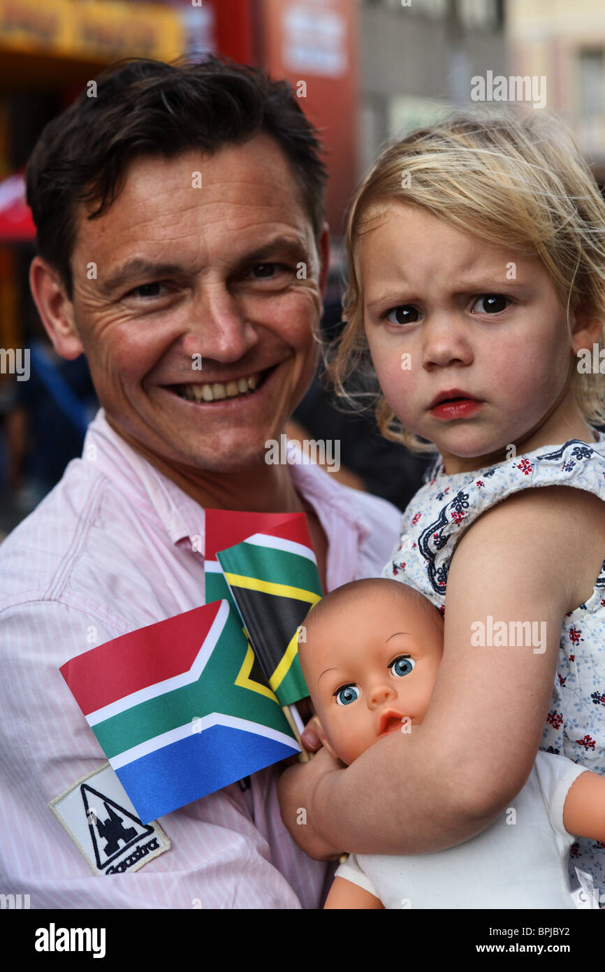 Father and daughter celebrating the Football world cup final draw, 04. ...