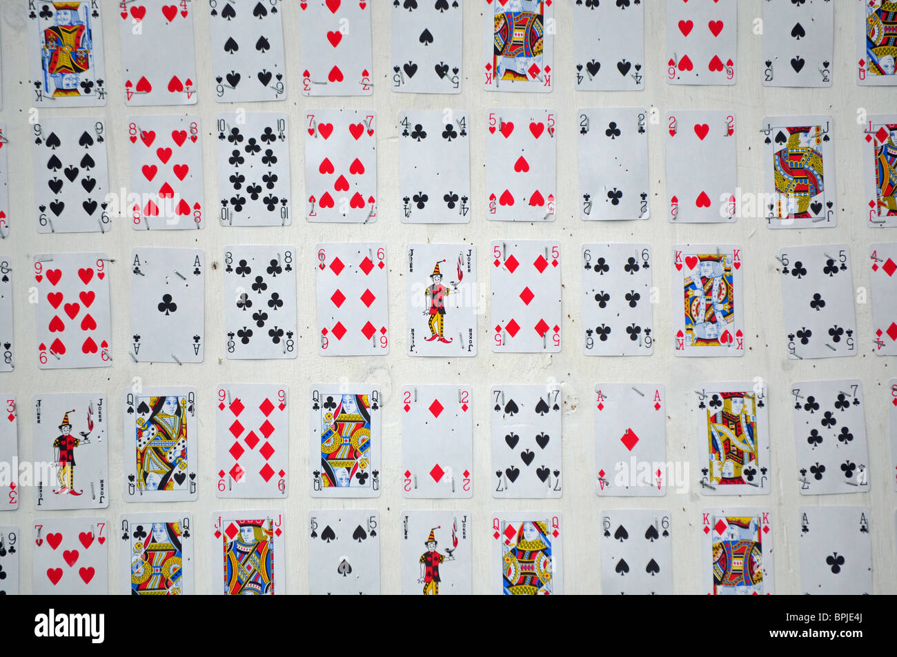 Playing cards on a fairground board game Stock Photo - Alamy
