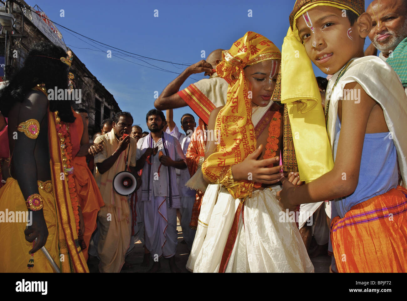 Dancing pilgrims and boys in front of the Jagannath Temple, Puri ...
