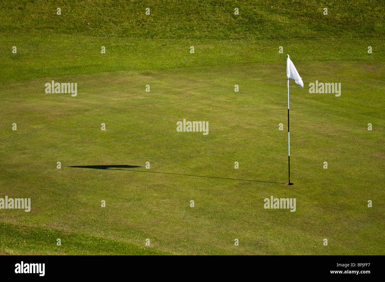 Golf course flag and hole, UK Stock Photo - Alamy