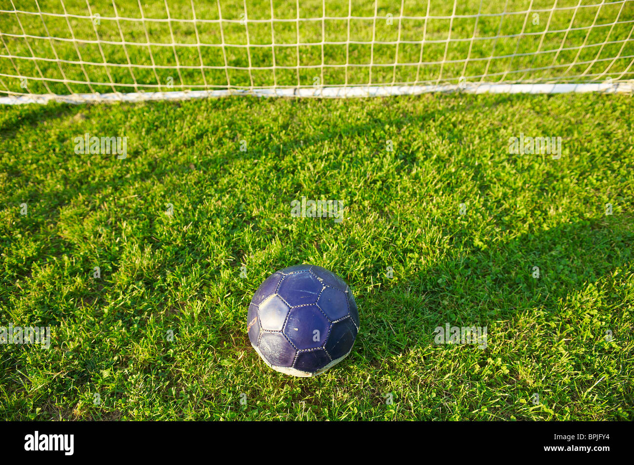 Soccer Ball on Grass in Front of Goal Stock Photo - Alamy