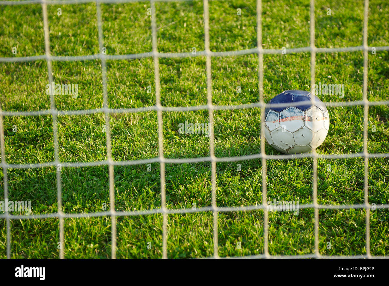 Soccer Ball on Grass in Front of Goal Stock Photo - Alamy