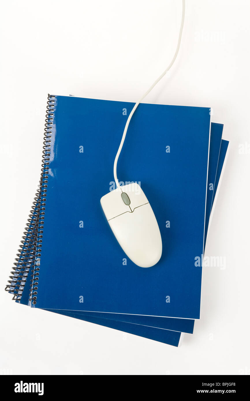 Blue school textbook and computer mouse, online learning Stock Photo ...