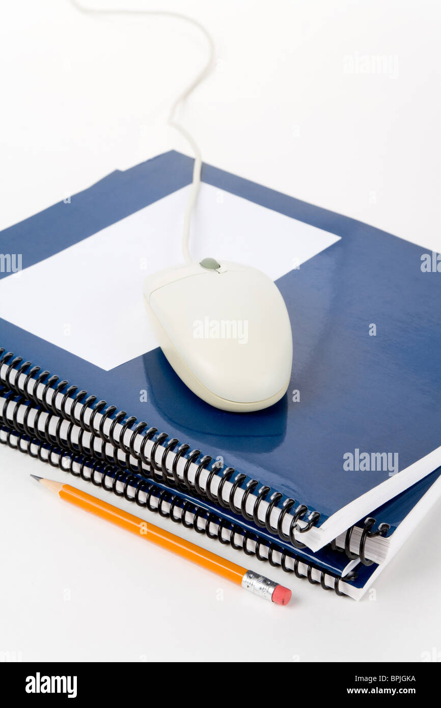 Blue school textbook and computer mouse, online learning Stock Photo ...
