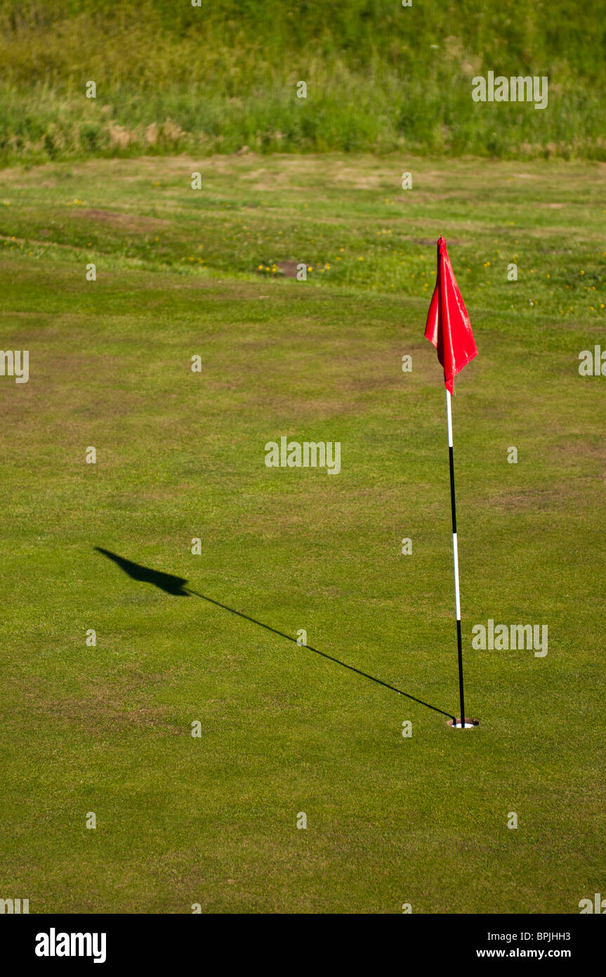 Golf course flag and hole, UK Stock Photo - Alamy