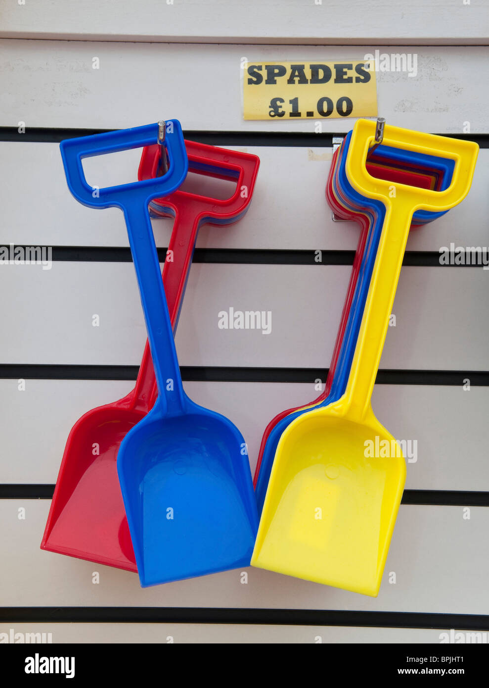 Plastic spades for sale at the Seaside (Scarborough, UK Stock Photo - Alamy