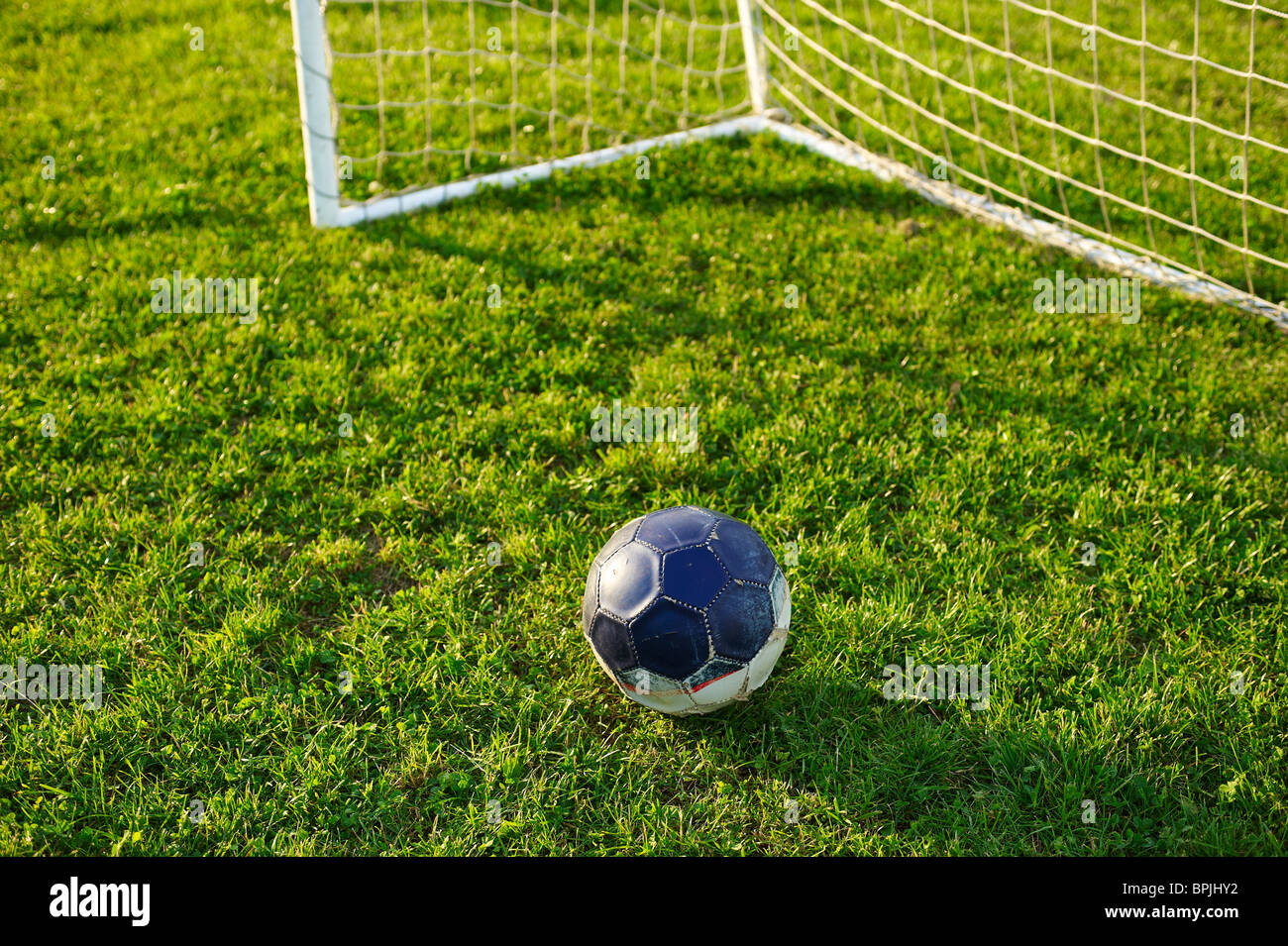 Soccer Ball on Grass in Front of Goal Stock Photo - Alamy