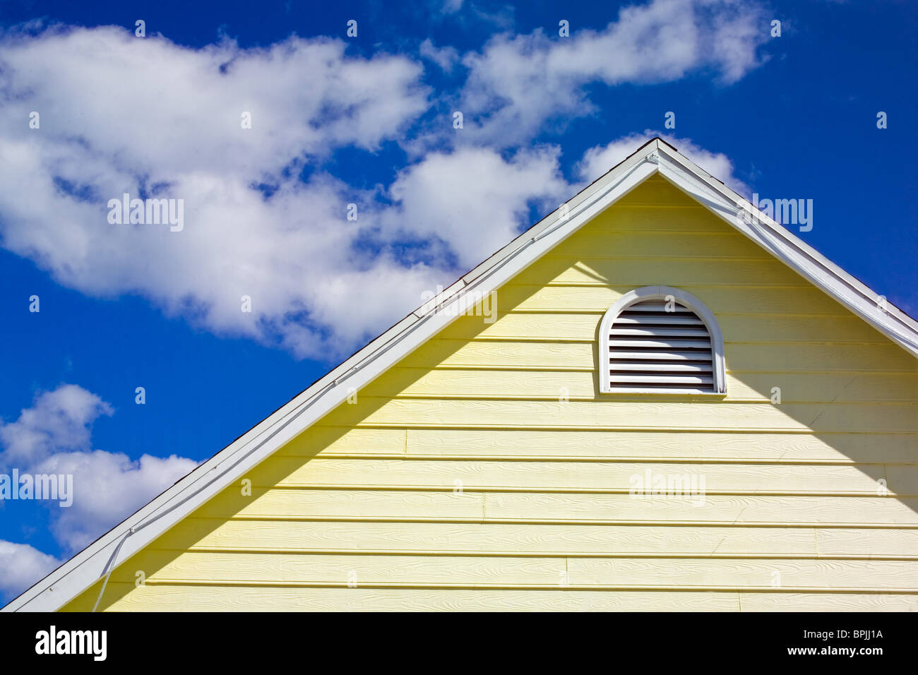 top of house and clouds in blue sky Stock Photo - Alamy