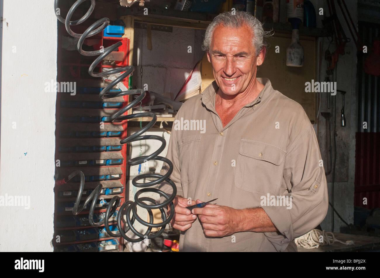 Hispanic mechanic in workshop Stock Photo - Alamy